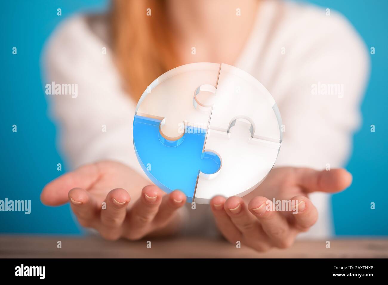 Circular object made of jigsaw puzzles over a person's fingers Stock ...