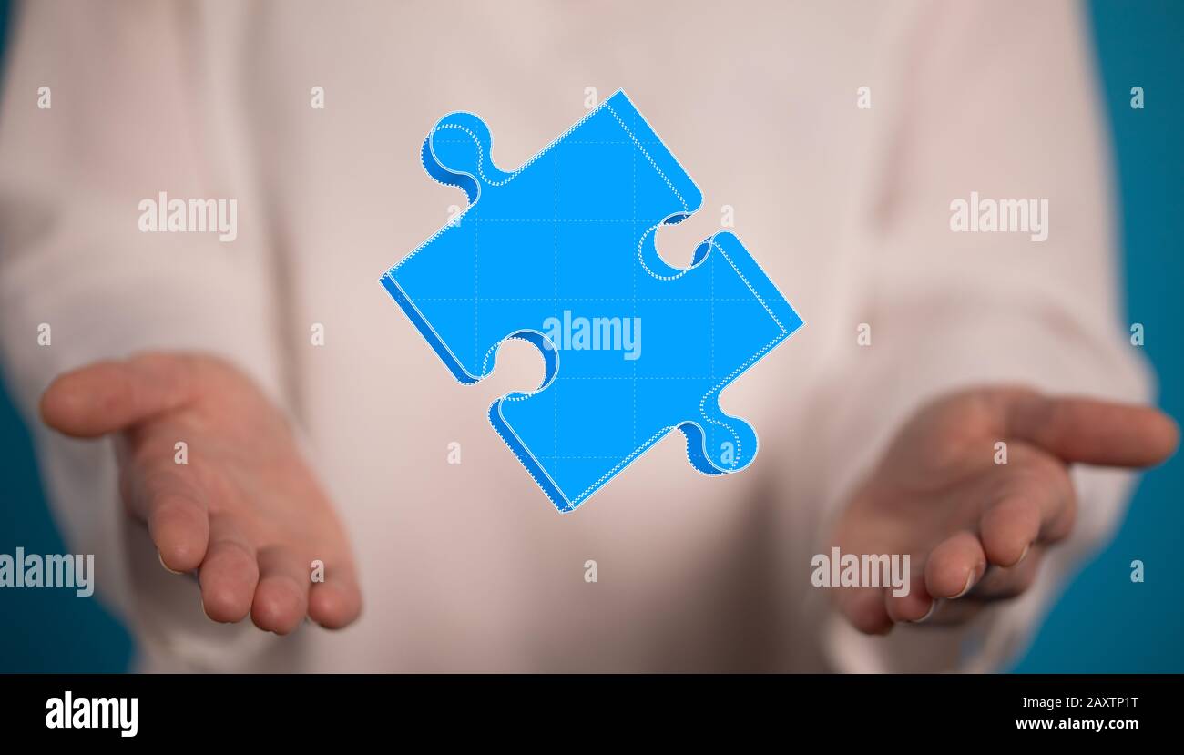 Blue piece of jigsaw puzzle over someone's hands Stock Photo - Alamy