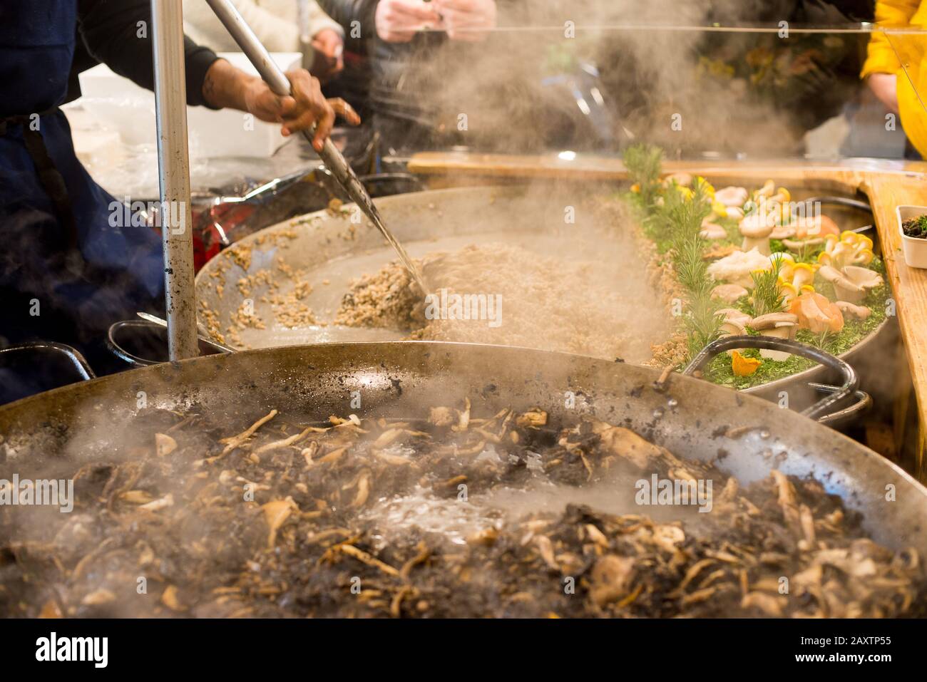 vegetarian curry cooking in hot steel pan at outdoor event Stock Photo ...