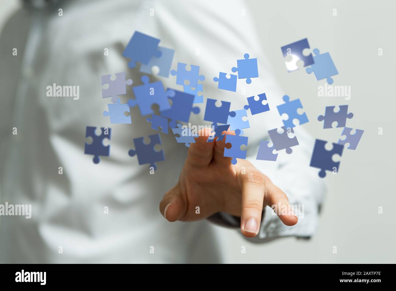 Illustration of different pieces of a jigsaw puzzle over someone's hand ...