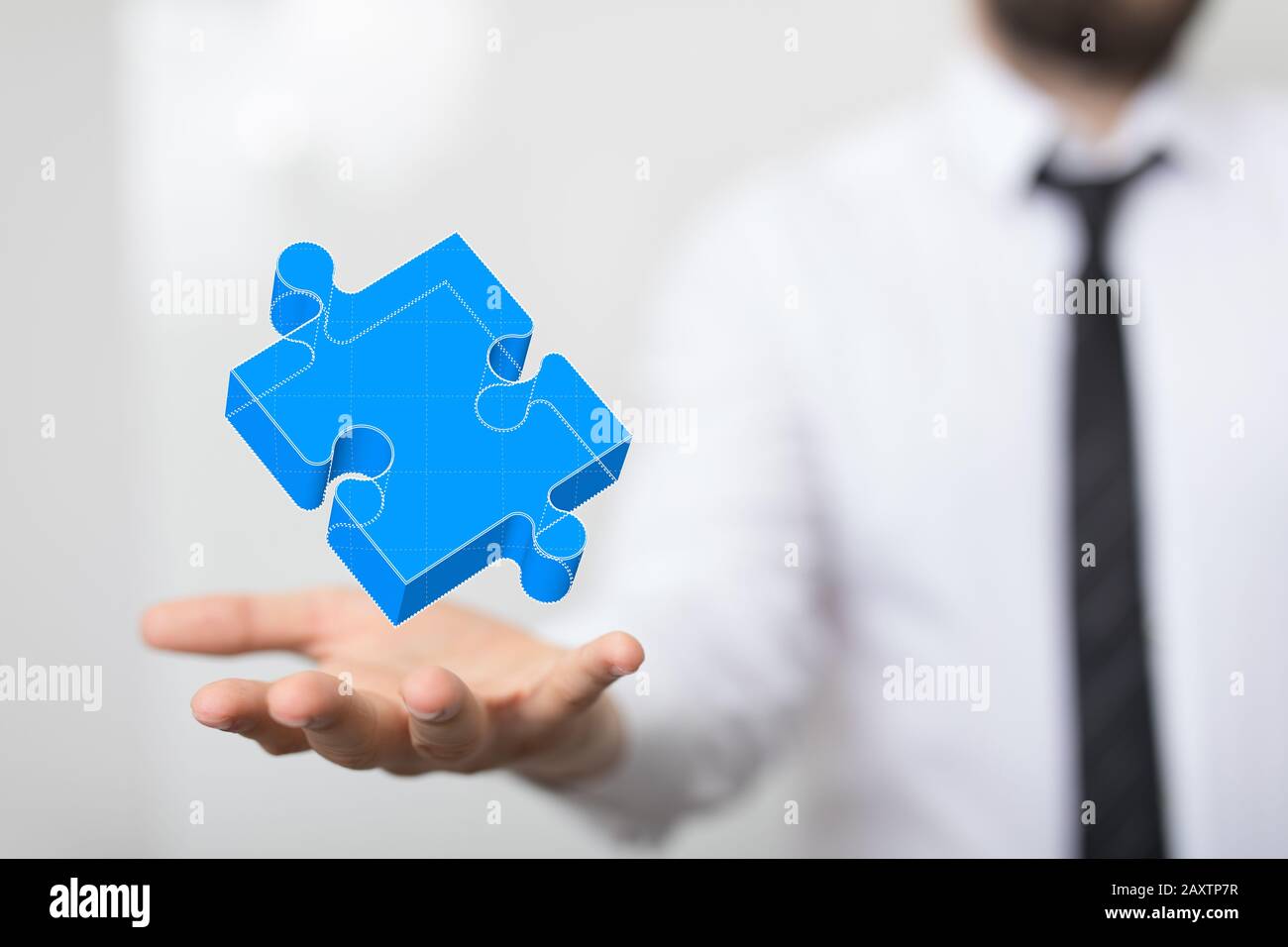 Illustration of a blue piece of a jigsaw puzzle over someone's hand ...