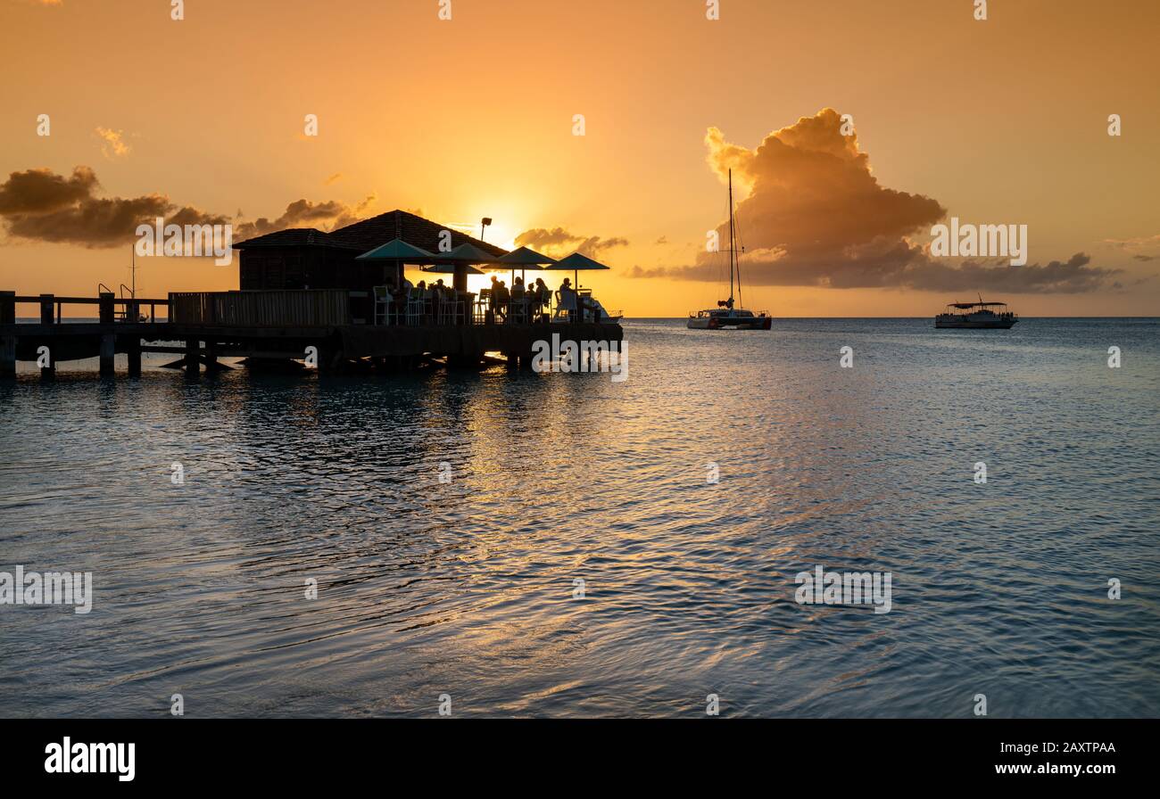 Cafe in the sea and a breathtaking sunset Stock Photo - Alamy