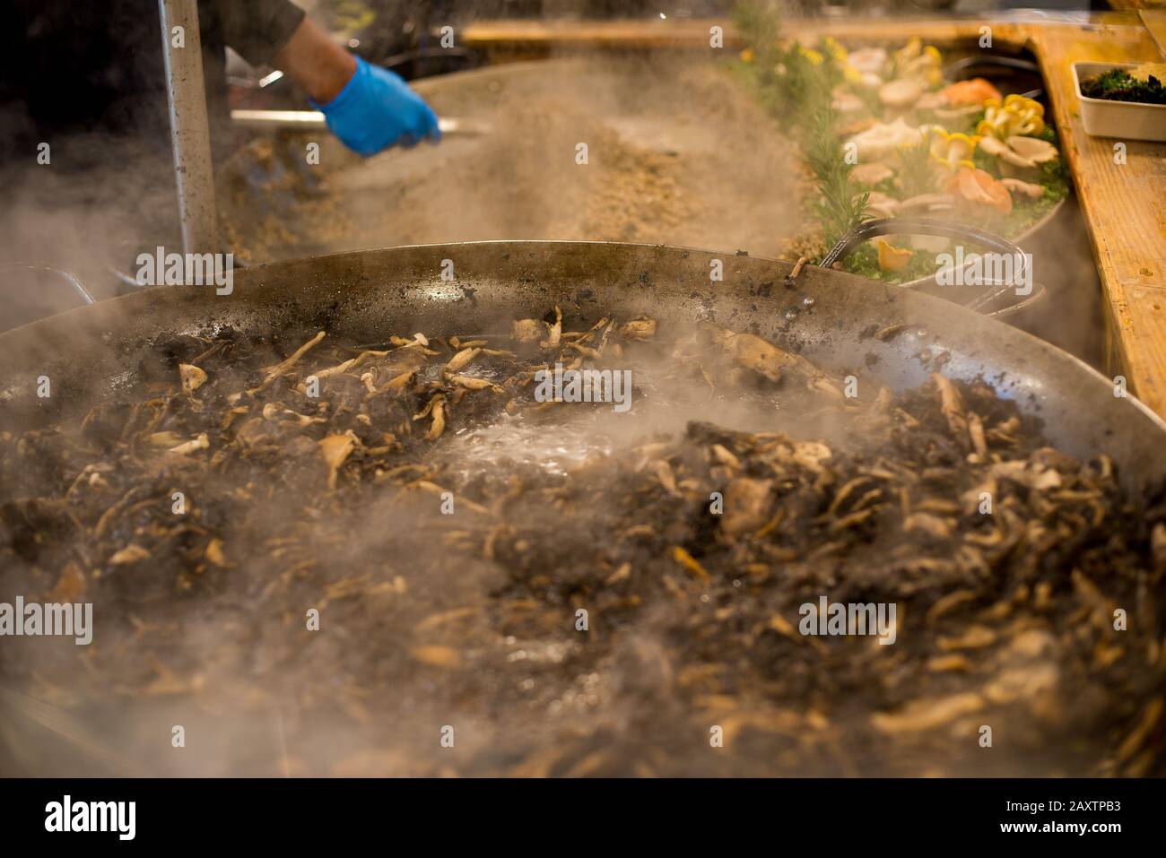vegetarian curry cooking in hot steel pan at outdoor event Stock Photo ...