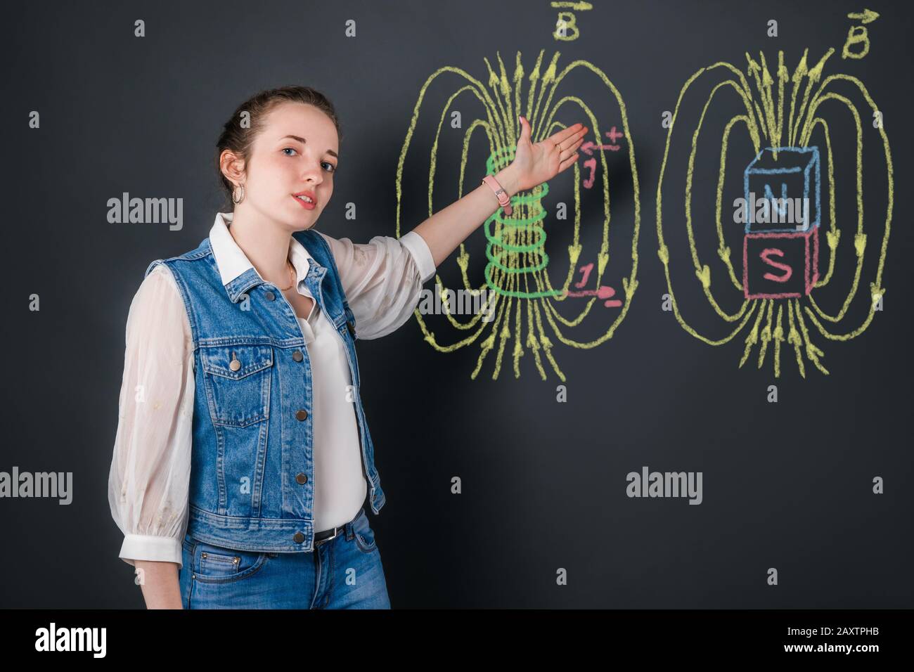 Young physics woman teacher talks about magnetic fields, explaining the ...
