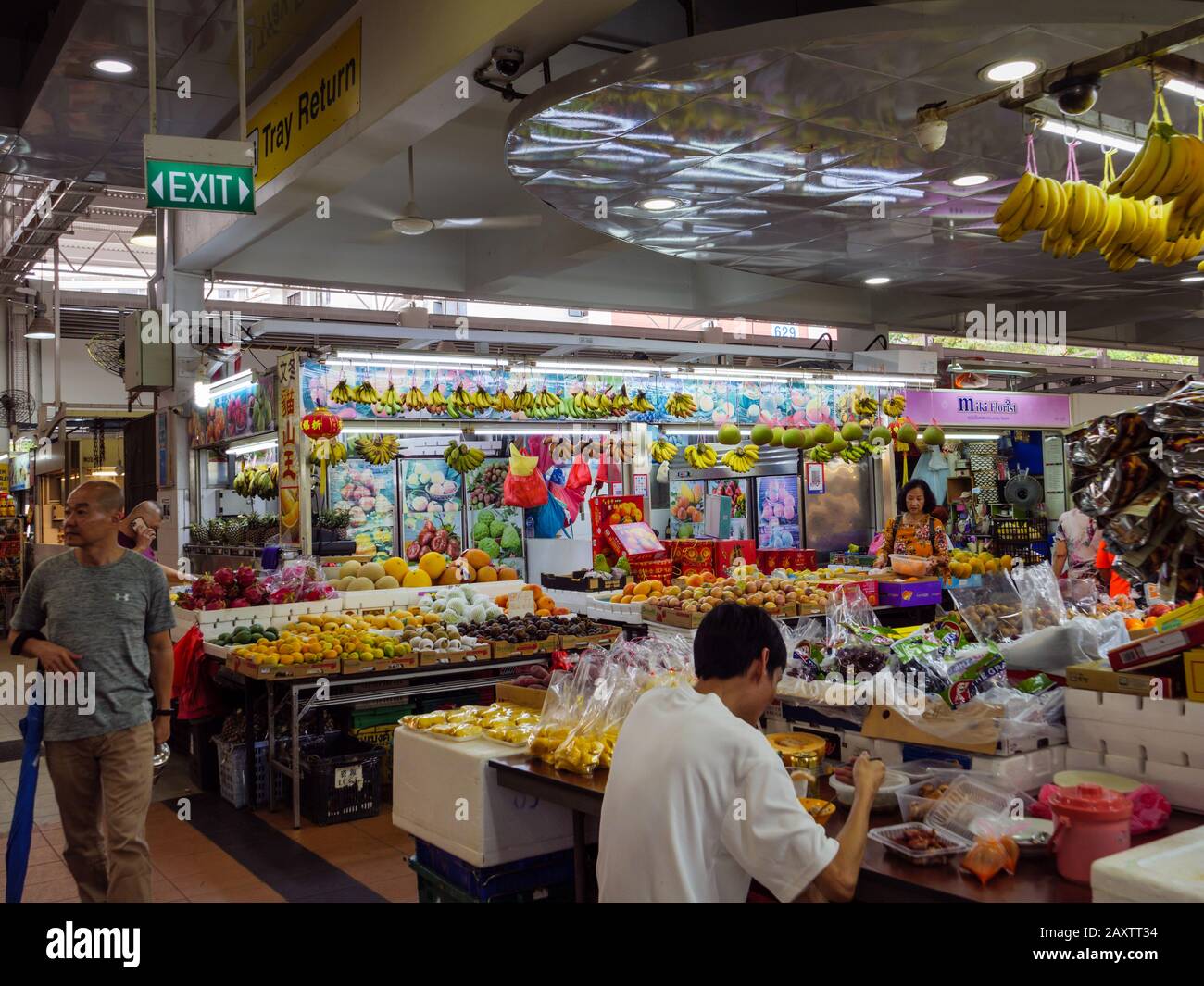 SINGAPORE – 4 JAN 2020 – A fruit seller takes a lunch break at a fruit ...