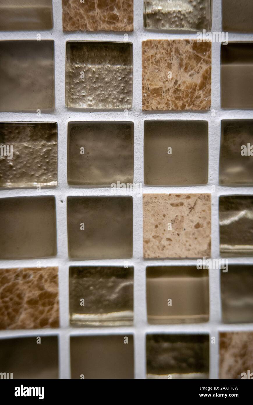 Brown ceramic mosaic on the wall as background Stock Photo - Alamy