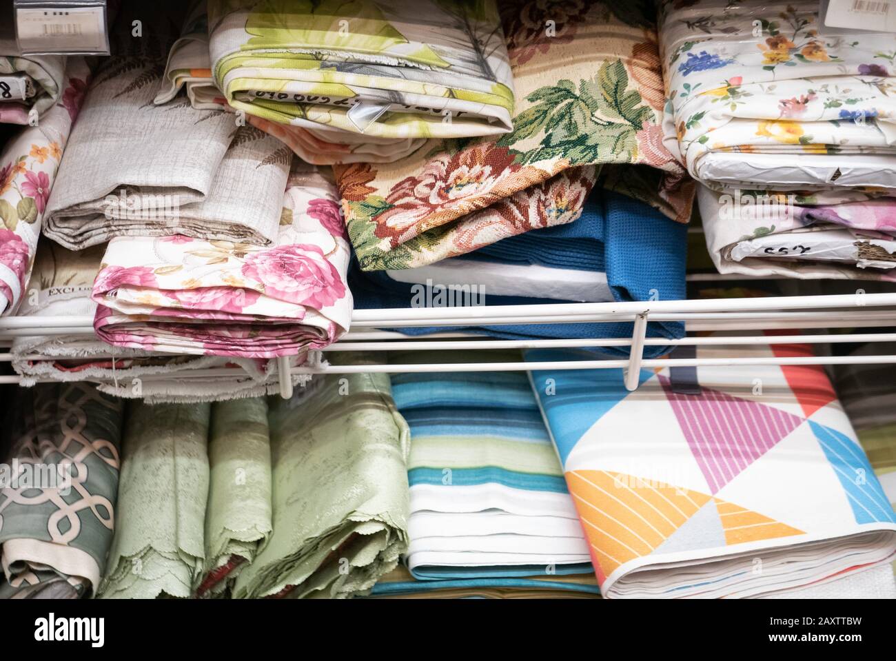 Rolls of fabric material in a textile shop Stock Photo - Alamy