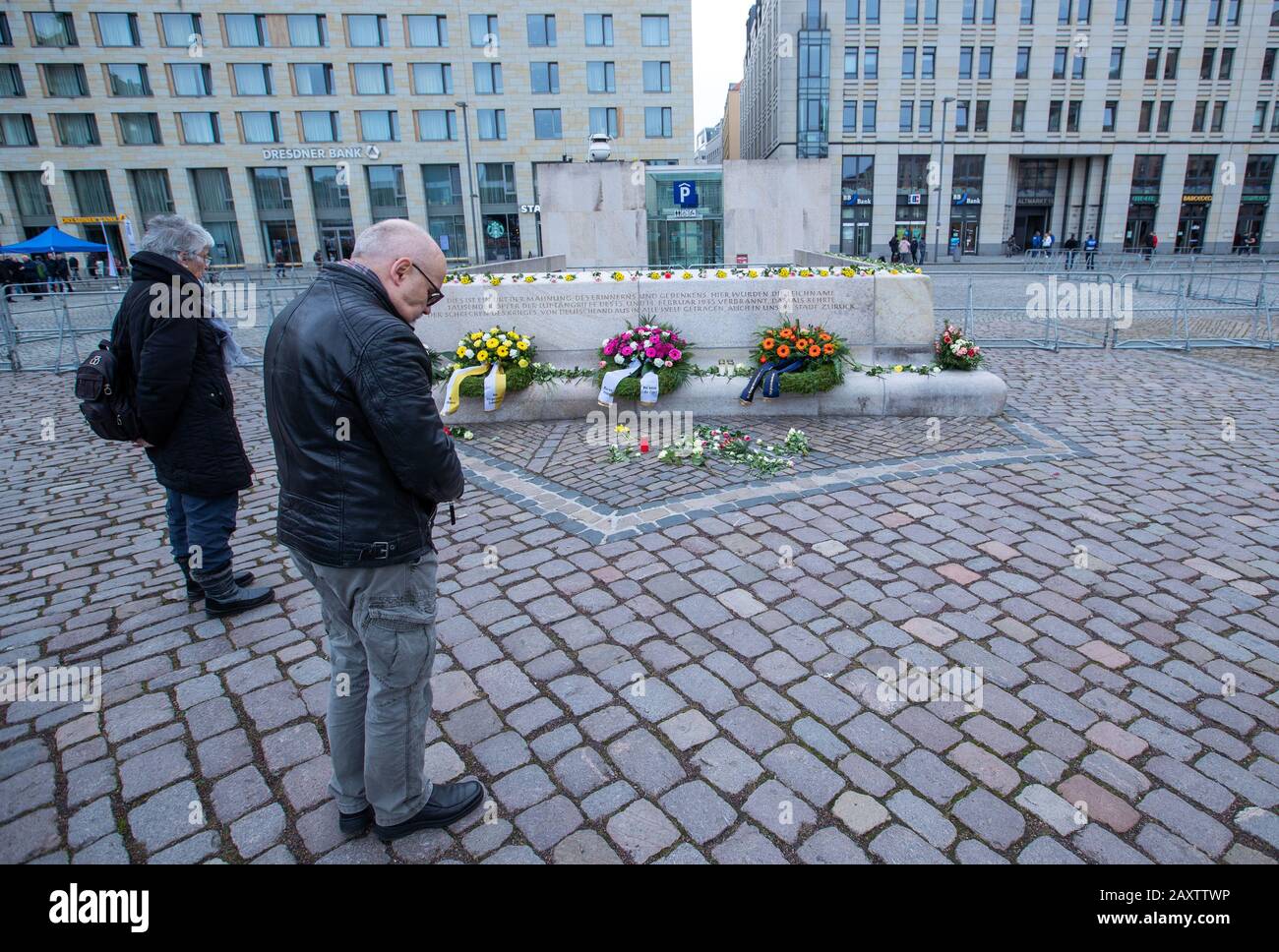 Dresden, Germany. 13th Feb, 2020. Citizens stand on the Altmarkt at a ...
