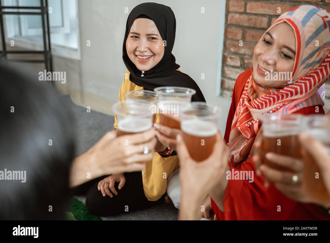 tea time with friend during lunch. muslim asian woman with friends ...