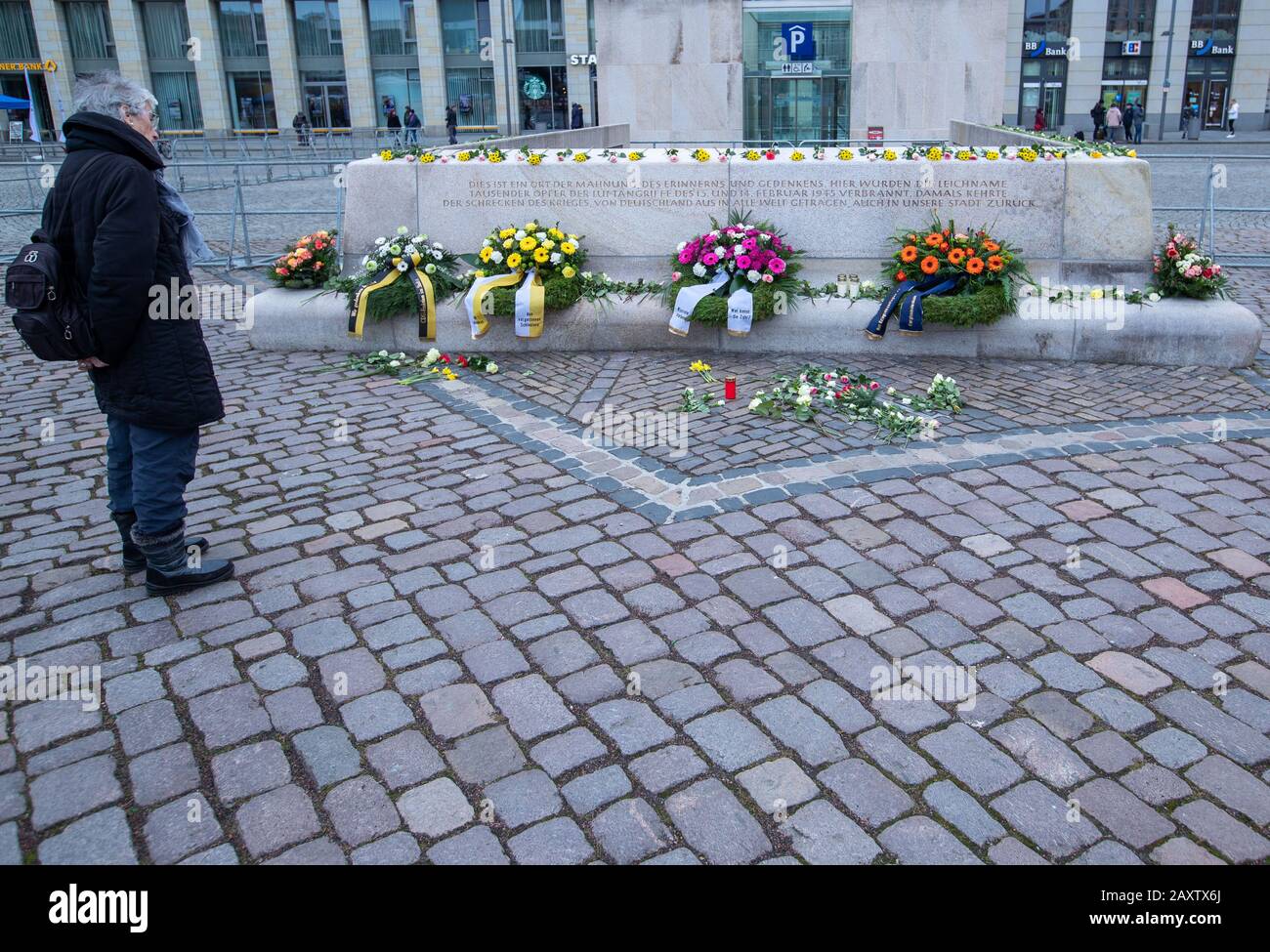 Dresden, Germany. 13th Feb, 2020. Citizens stand on the Altmarkt at a ...
