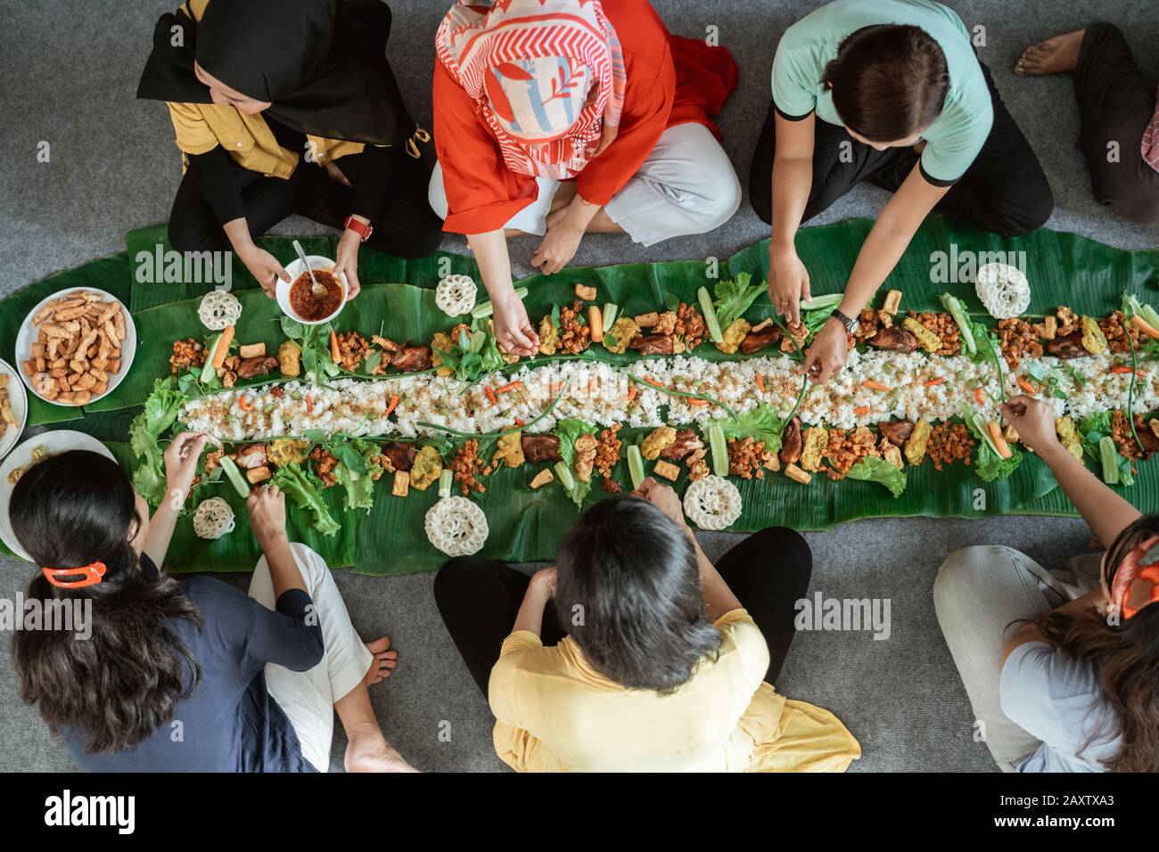 javanese traditional culinary. people eating kembulan shot from above ...