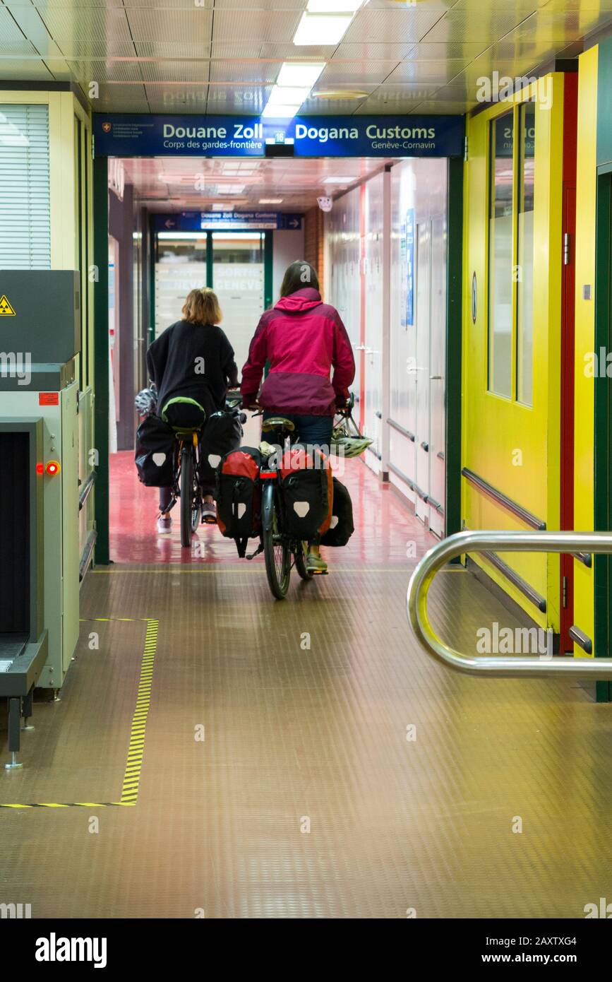 Two cyclists tourist on bike ride / pass through Customs / Douanes at ...