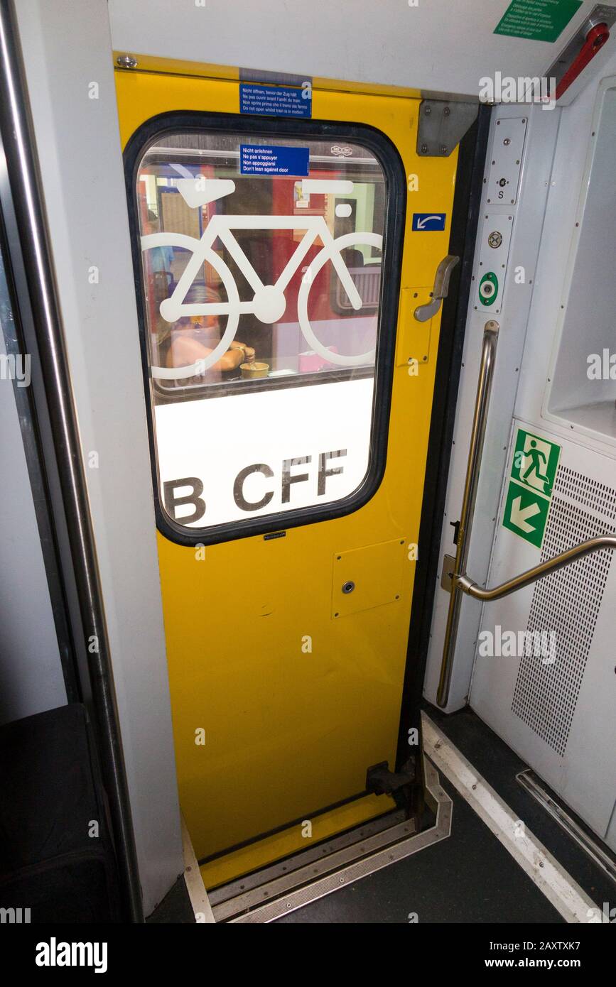 Interior showing the door exit from the inside of Swiss train carriage ...