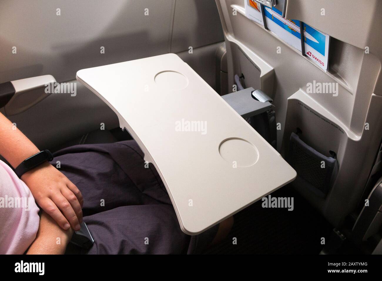 Passenger seat tray table in the full down position ready for use, on a ...