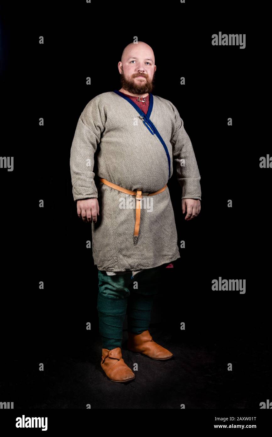 Overweight bearded man in the image of a medieval merchant Stock Photo ...