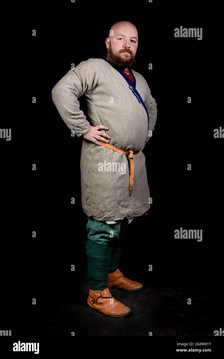 Overweight bearded man in the image of a medieval merchant Stock Photo ...
