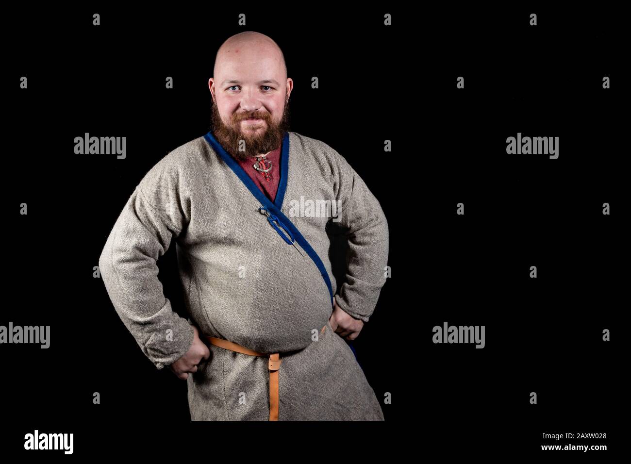 Overweight bearded man in the image of a medieval merchant Stock Photo ...