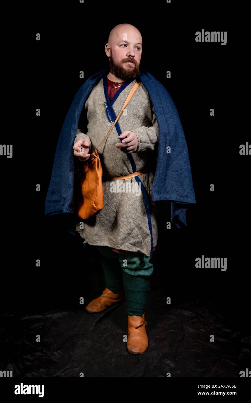 Overweight bearded man in the image of a medieval merchant Stock Photo ...