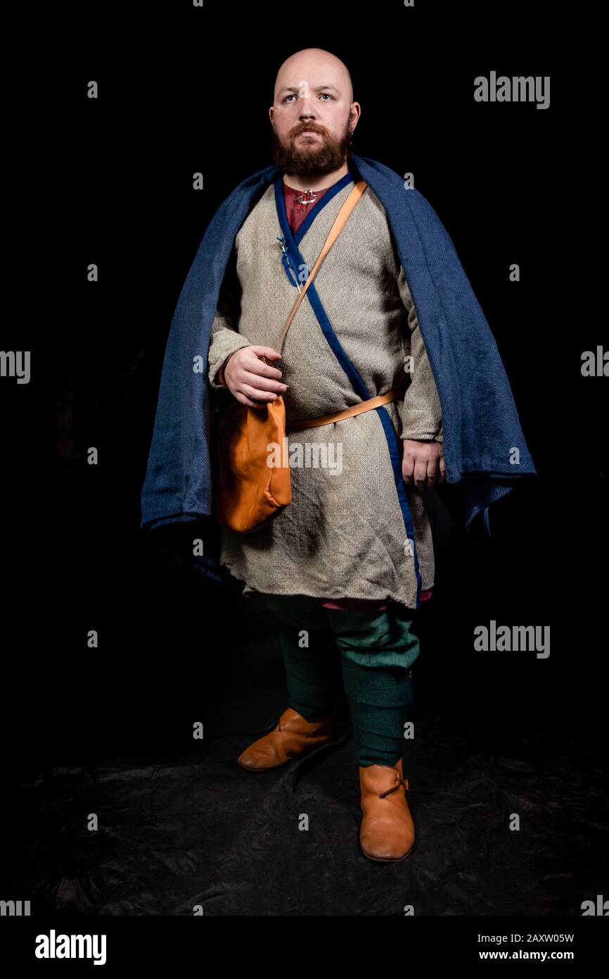 Overweight bearded man in the image of a medieval merchant Stock Photo ...