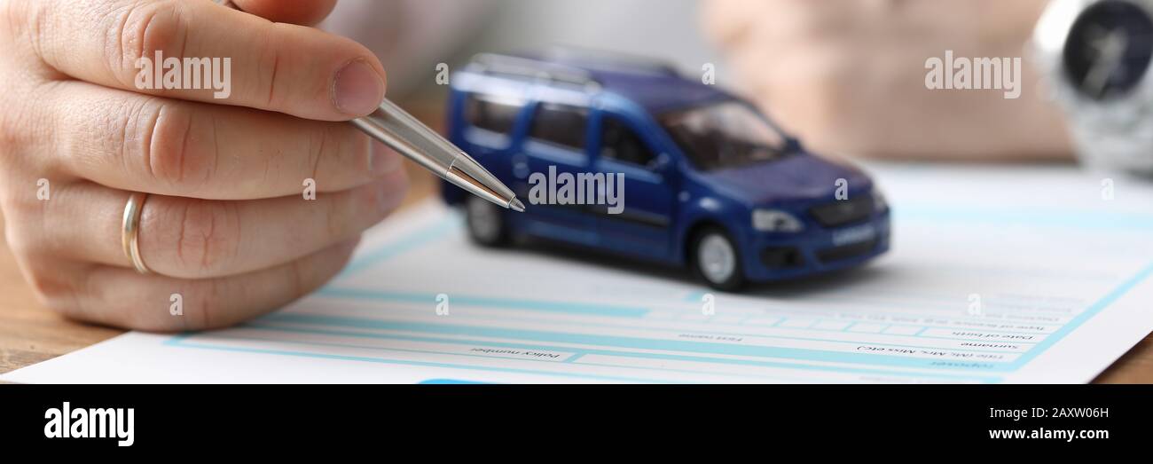 Presentable man holding silver pen Stock Photo - Alamy