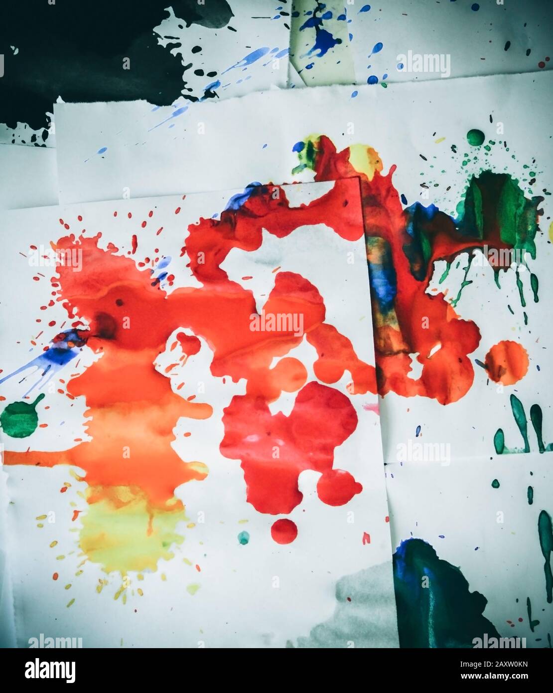 Many red colored blots on white paper with streaks. Abstract creative ...
