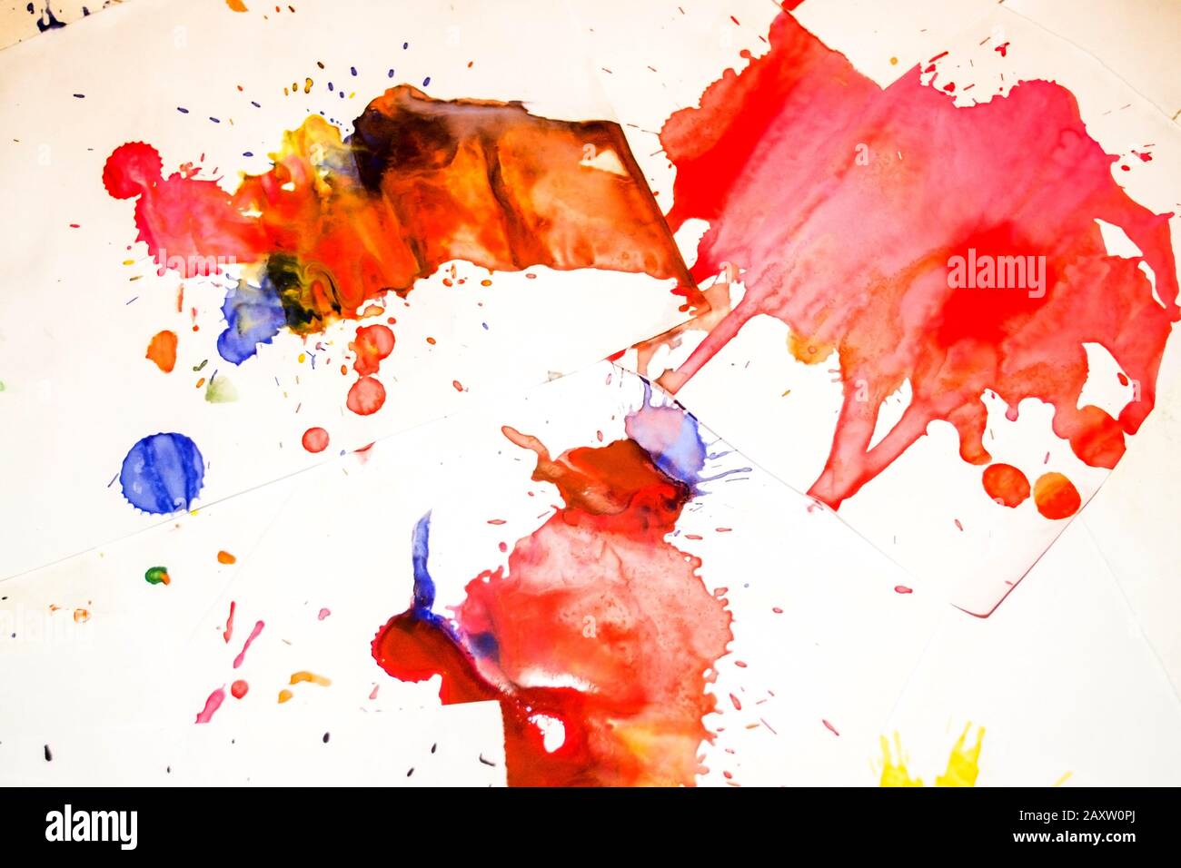 Many red colored blots on white paper with streaks. Abstract creative ...