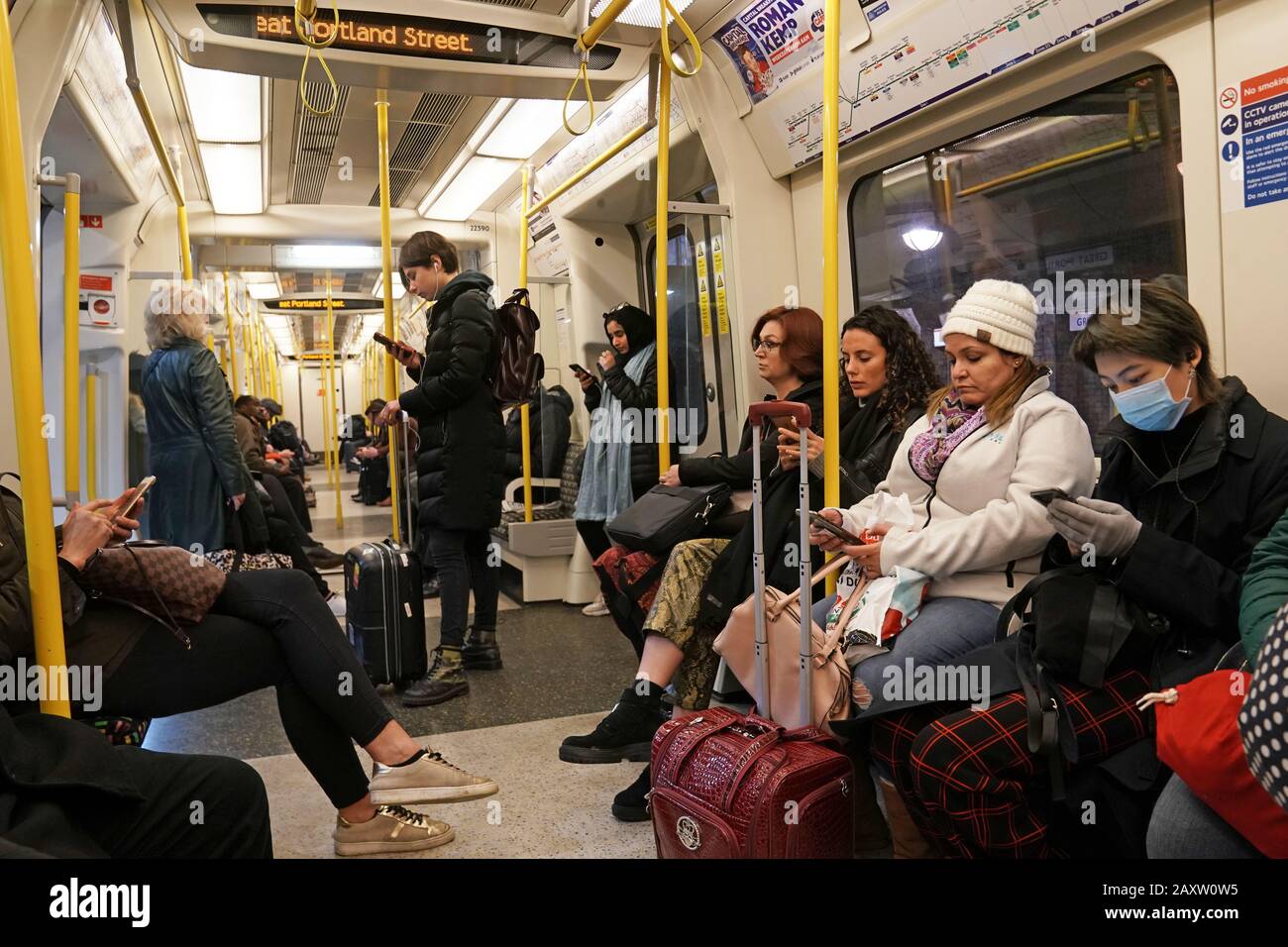 A woman wearing a face mask on the London Underground Stock Photo - Alamy