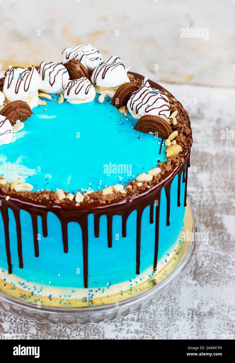 Blue cream cake in a marine style on a light backgroundwith chocolate ...