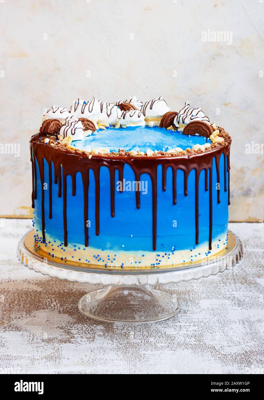 Blue cream cake in a marine style on a light backgroundwith chocolate ...