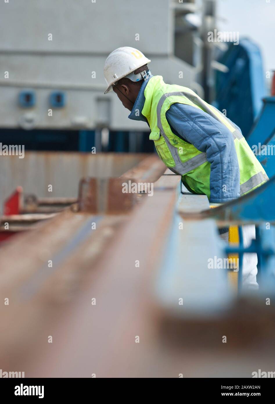 Ship worker inspecting the loading and unloading of cargo Stock Photo ...