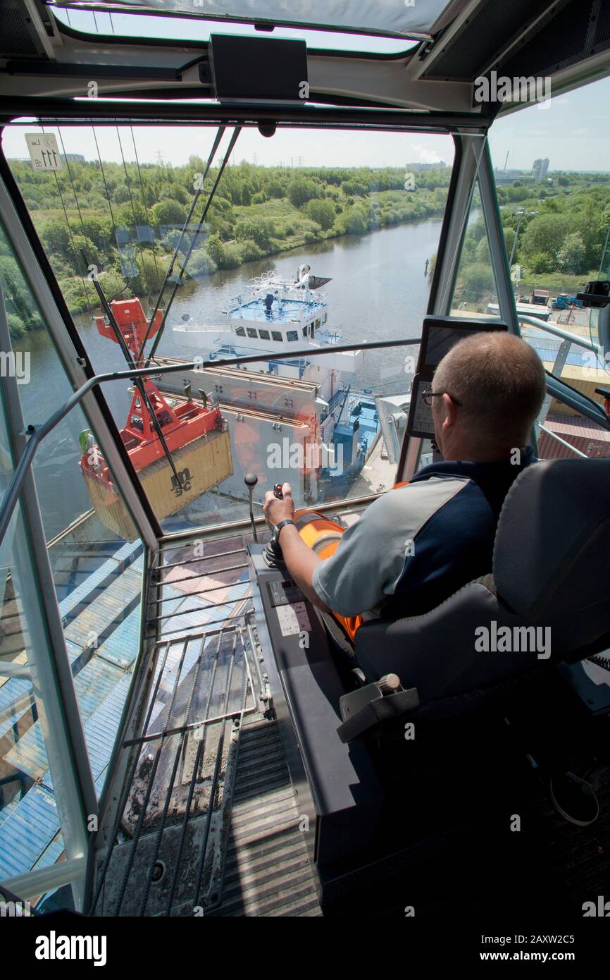 View from inside of Liebherr crane loading and unloading containers ...