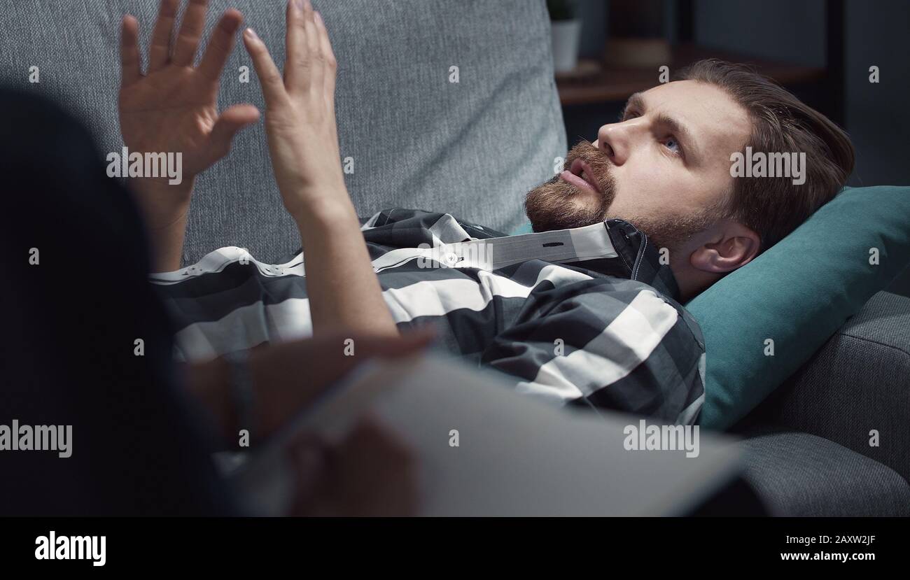 Lying man speaking with psychologist Stock Photo - Alamy