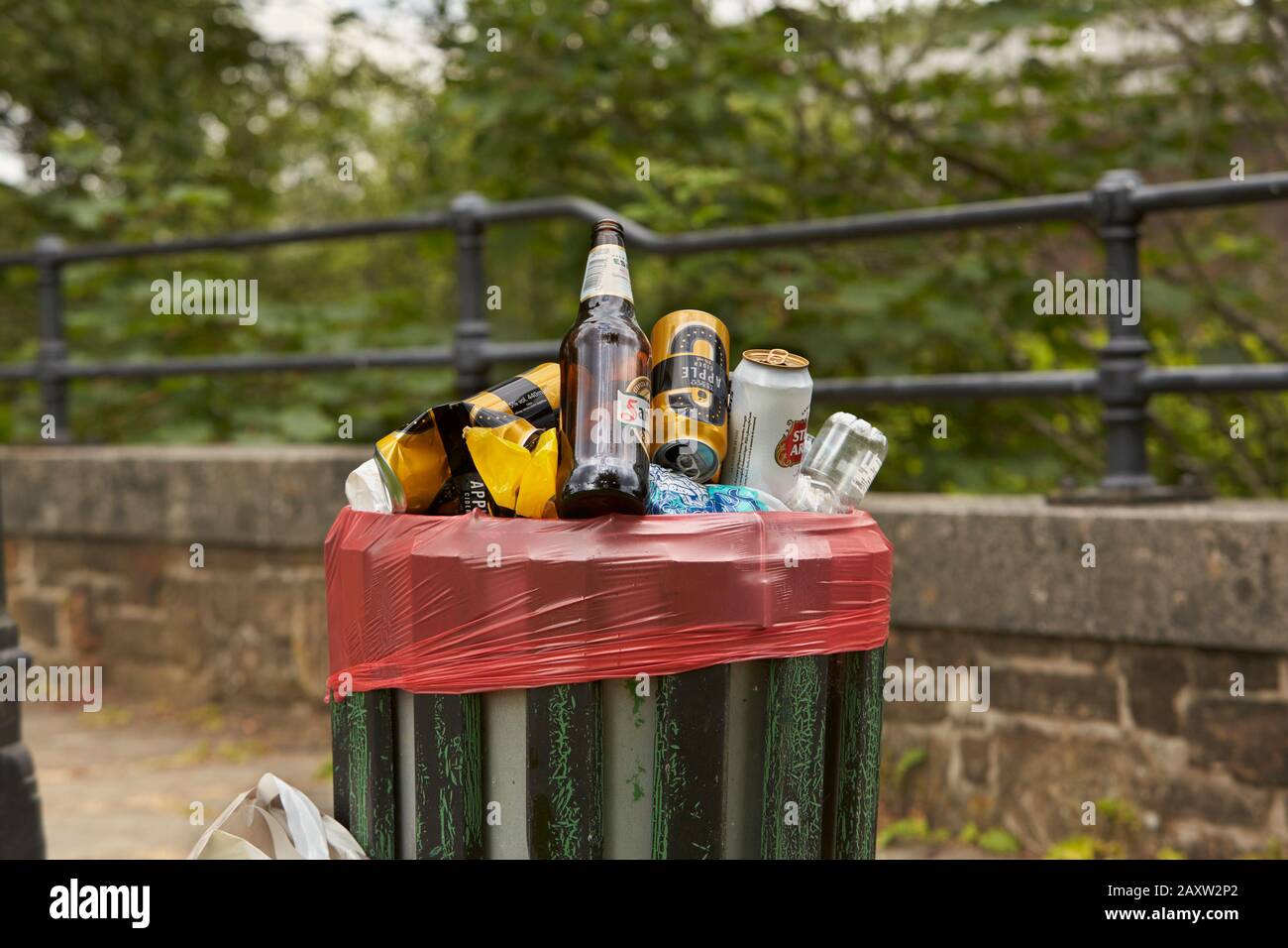 Glass beer bottles, aluminium drinks cans and plastic thrown away, in ...