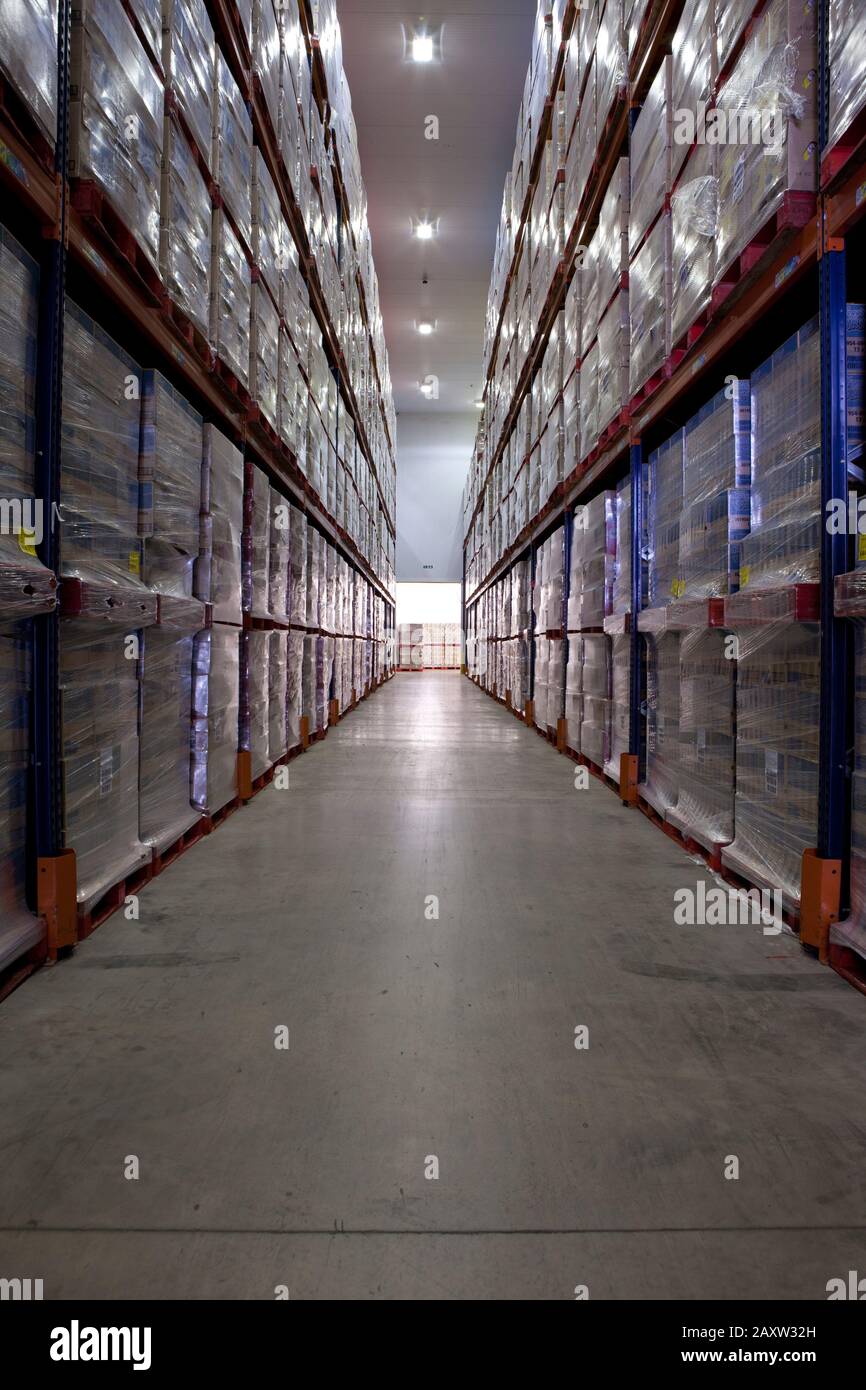 Pallets stacked in new climate controlled warehouse Stock Photo - Alamy