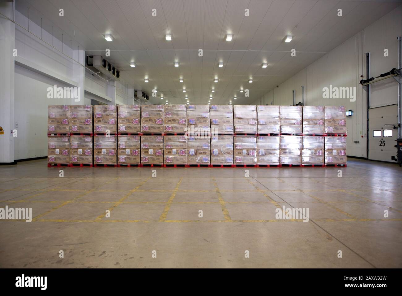 Pallets stacked in new climate controlled warehouse Stock Photo - Alamy