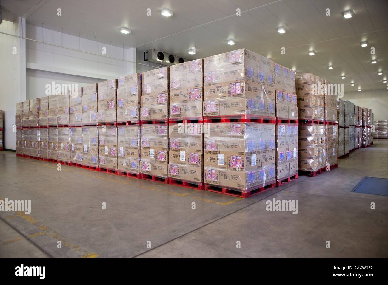 Pallets stacked in new climate controlled warehouse Stock Photo - Alamy