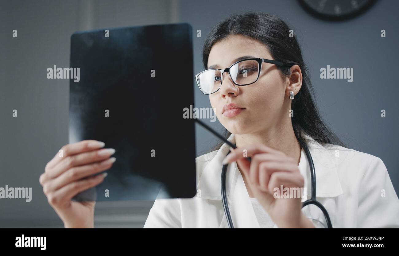 Young nice doctor watching patient hi-res stock photography and images ...