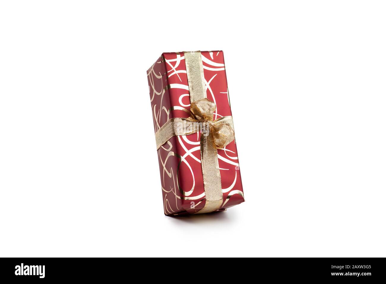 packaged rectangular gift in burgundy packaging with gold bow and gold ...