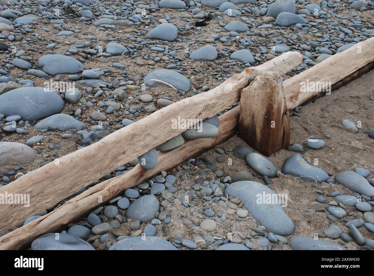 Wooden groin on beach Stock Photo - Alamy