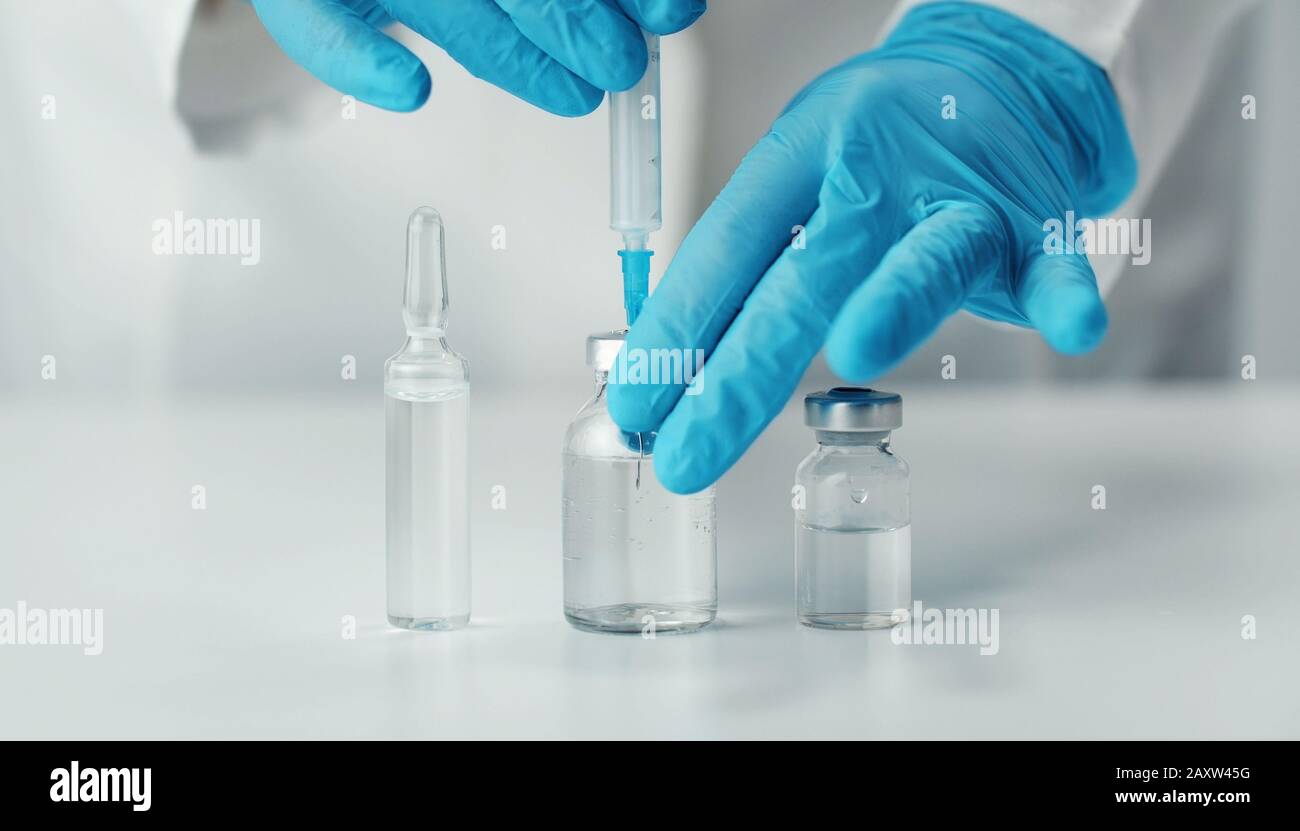 Closeup syringe vaccine vial hi-res stock photography and images - Alamy