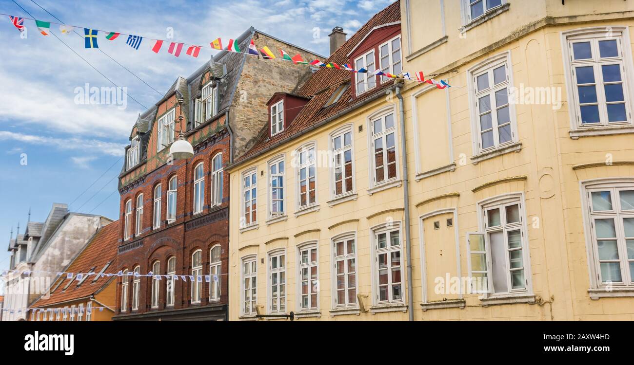 Panorama of old buildings and flags in the historic center of Haderslev ...