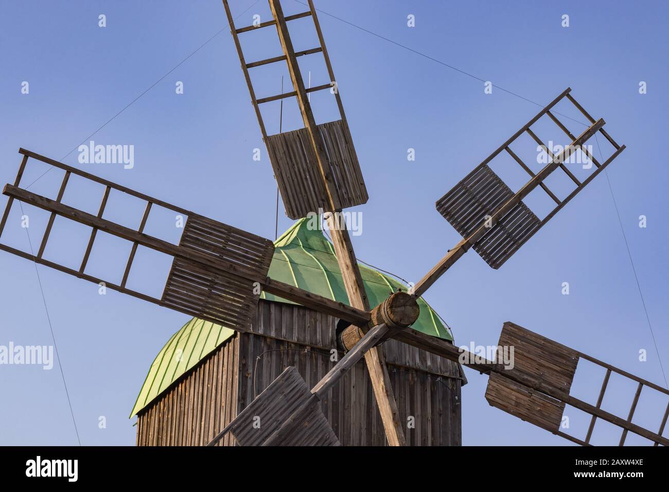 Traditional Ukrainian Windmill on blue sky background in Pirogovo Stock ...
