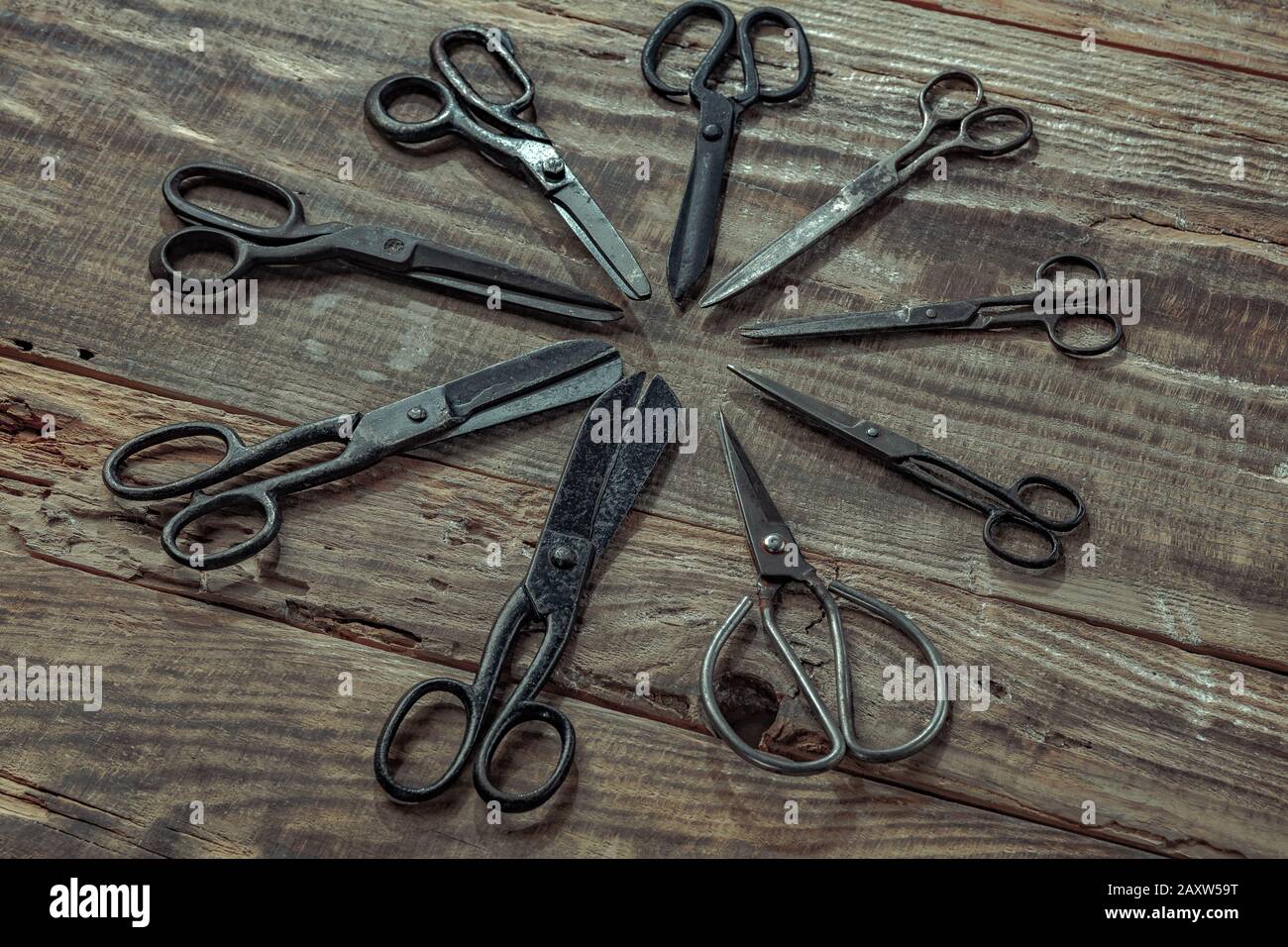 Vintage steel scissors on wooden table background. Old-fashioned ...