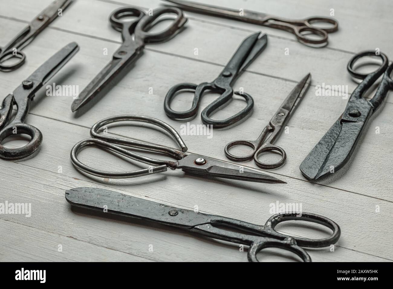 Vintage steel scissors on wooden table background. Old-fashioned ...