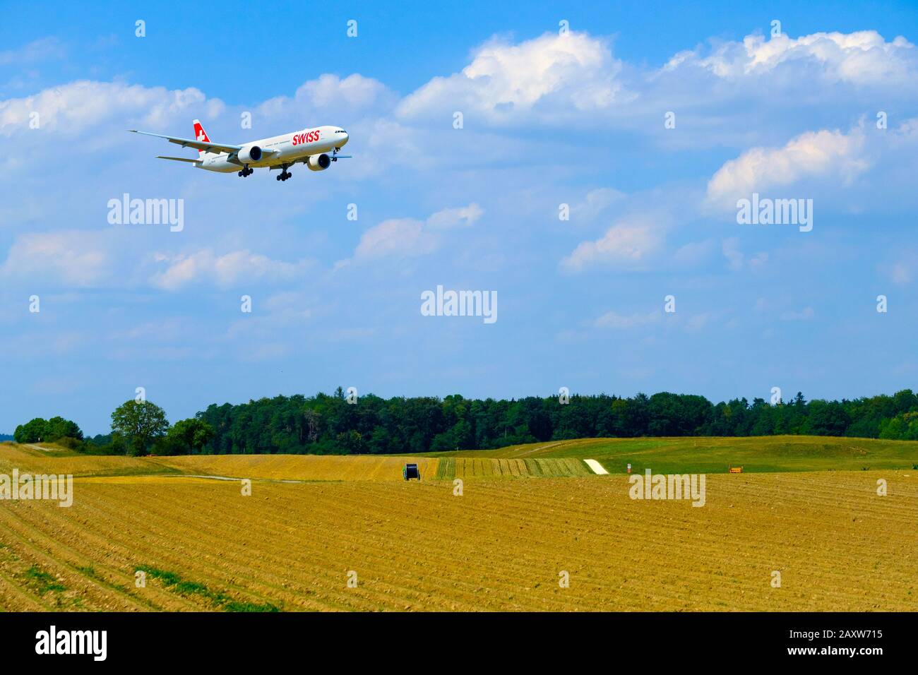 Airplane above beautiful lawns and forest in countryside Stock Photo ...