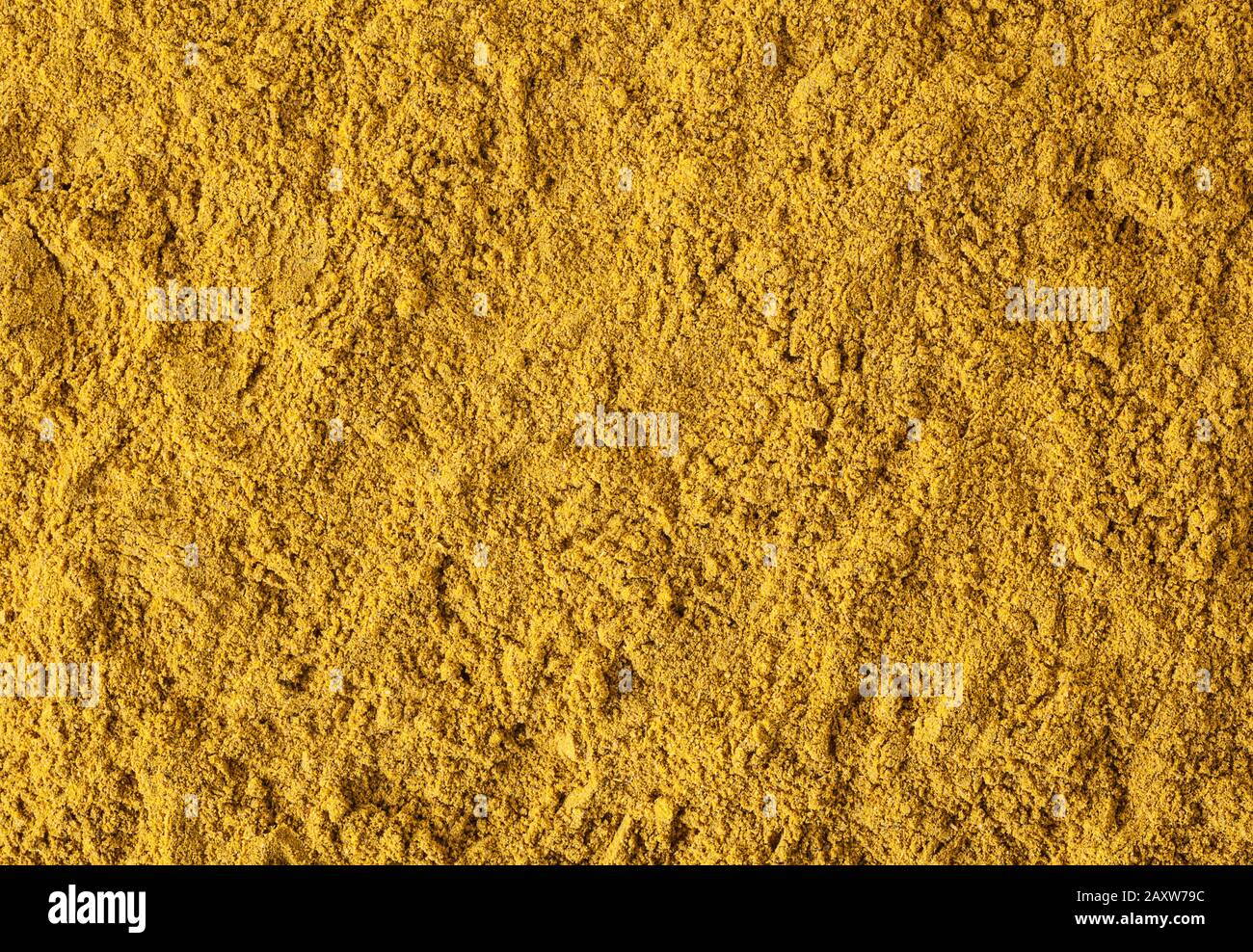 Curry powder background Stock Photo - Alamy