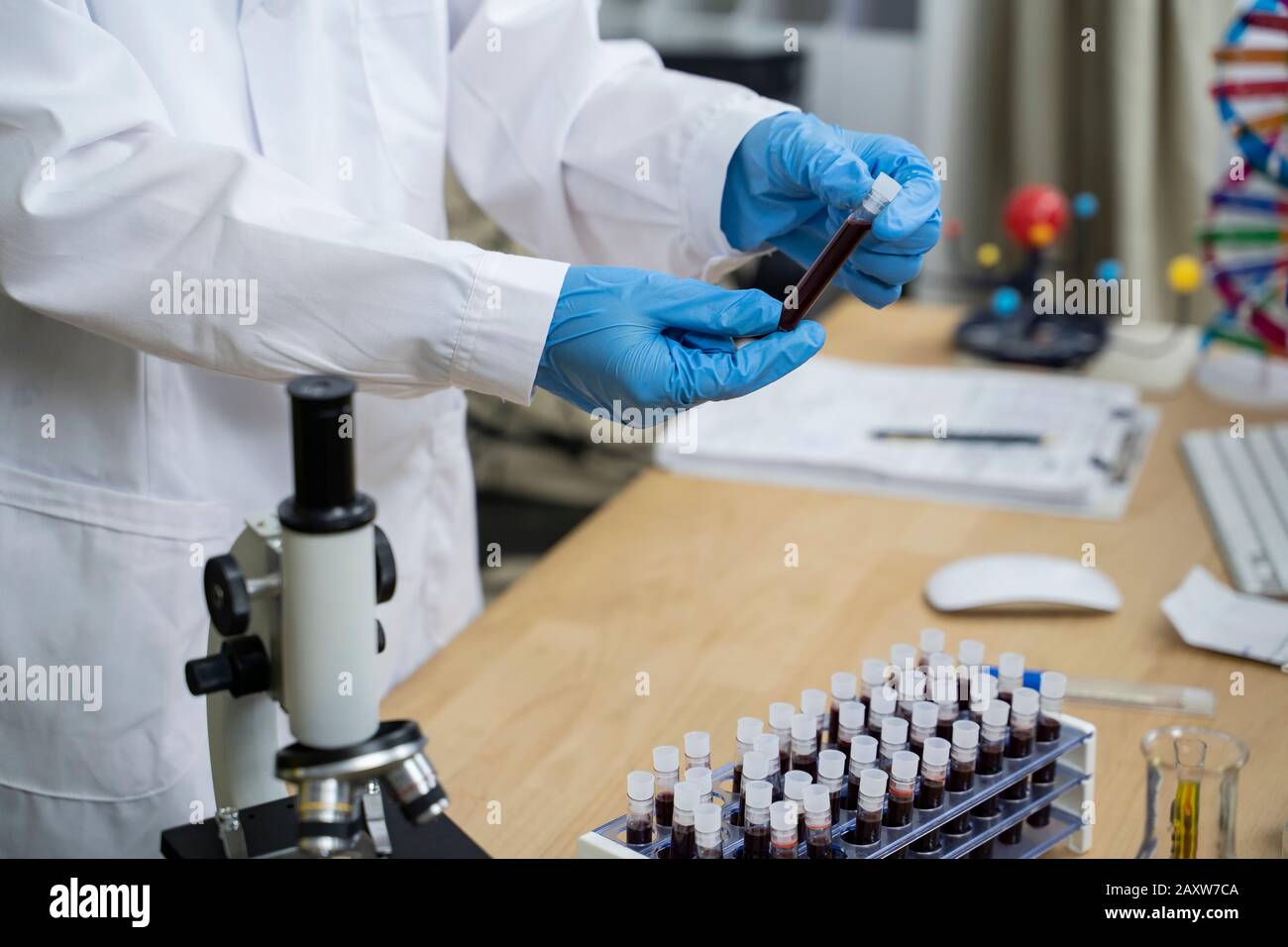 Doctor hand taking a blood sample tube of analysis in the lab ...