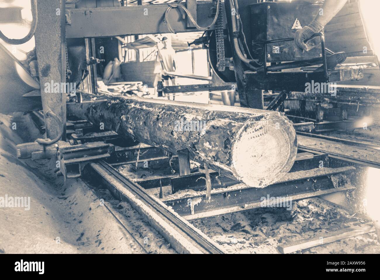Photo in old vintage style. Sawmill. Process of machining logs in ...
