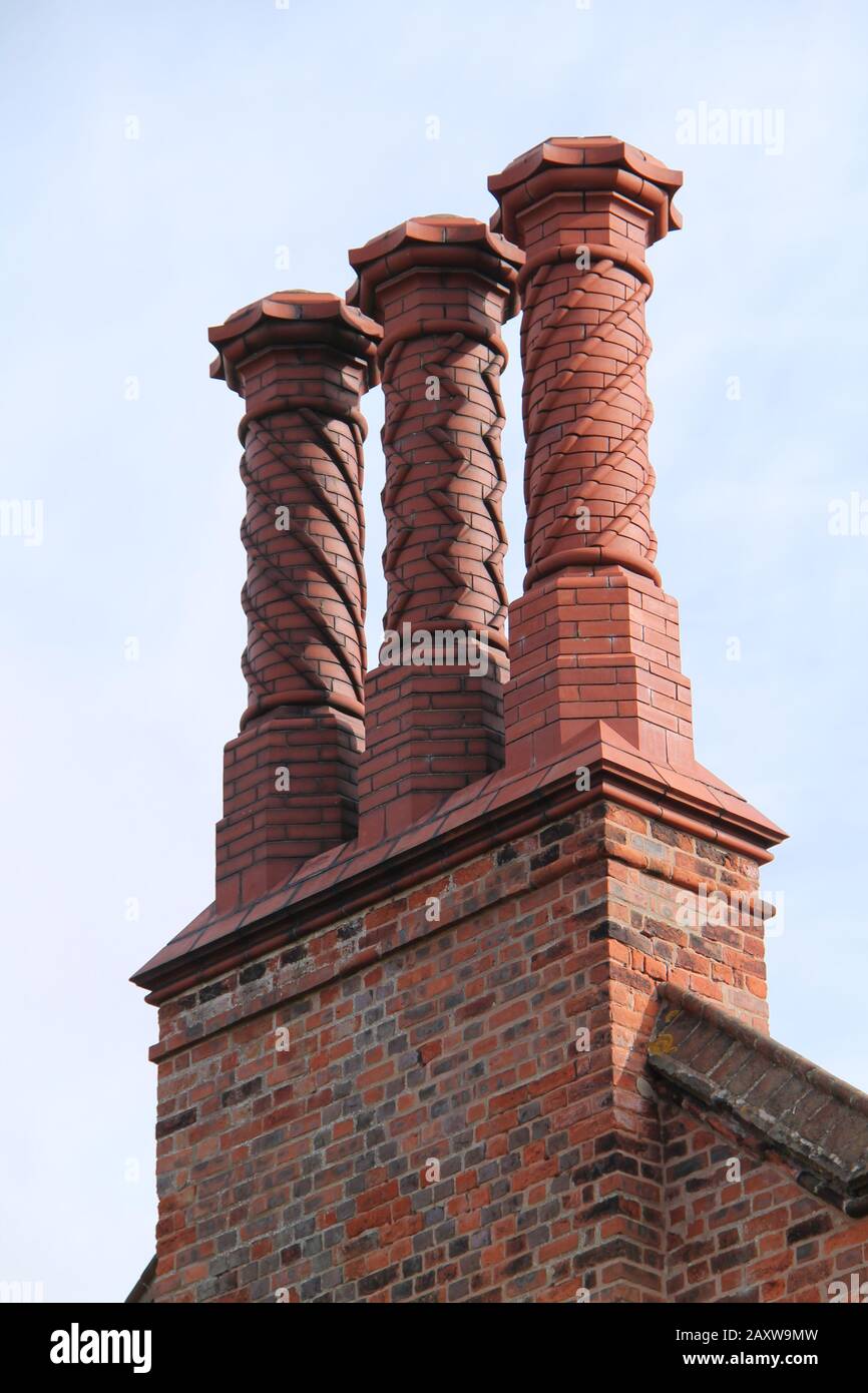 Three tall factory chimneys hi-res stock photography and images - Alamy