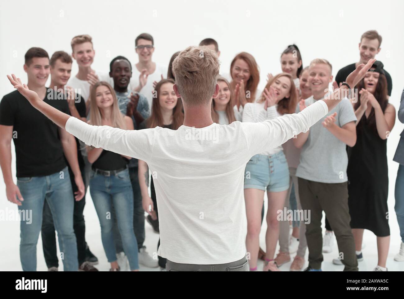 rear view. a happy leader standing in front of a creative business team ...